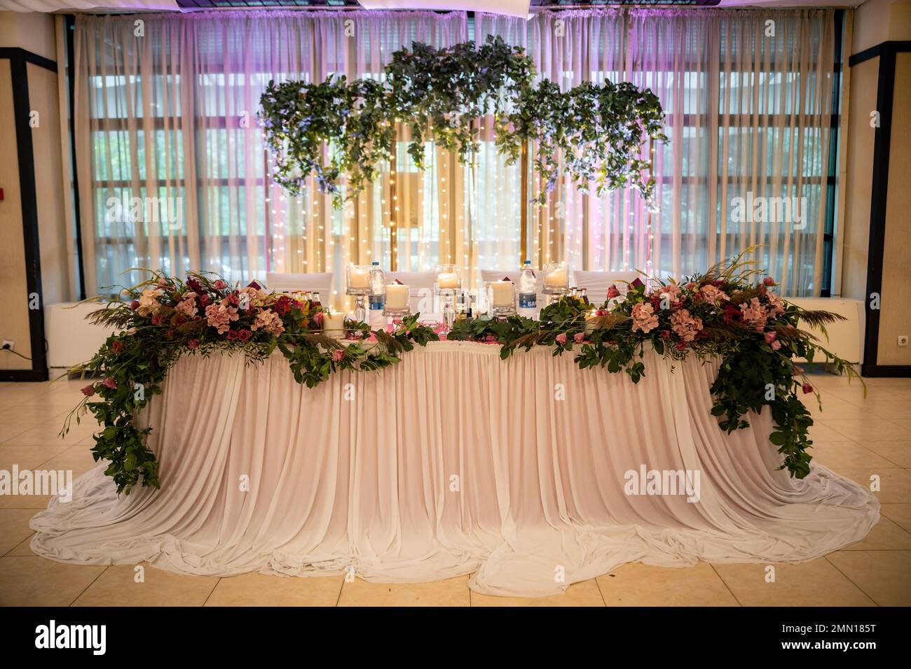 Wedding flowers set up in a restaurant. A wedding colorful bouquet ...