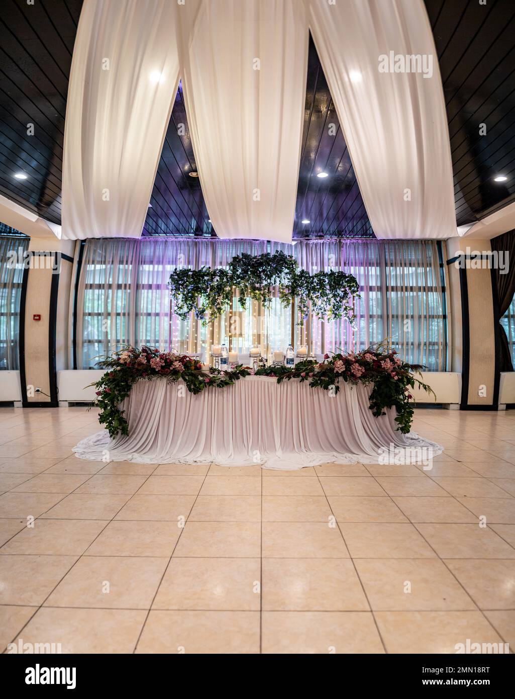 Wedding flowers set up in a restaurant. A wedding colorful bouquet ...