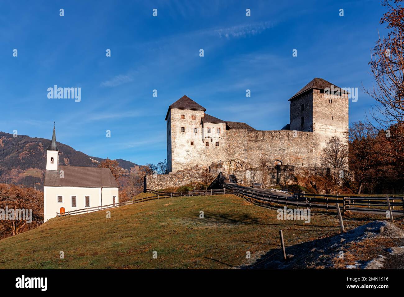 Old medieval castle and St. Jacob Chapel, Kaprun, Austria Stock Photo ...