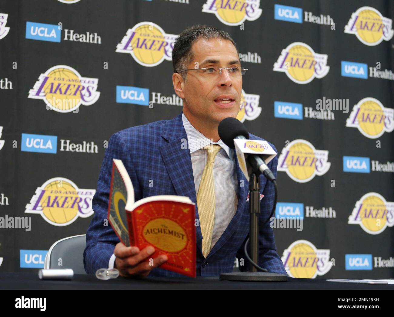 Los Angeles Lakers general manager Rob Pelinka reads a passage from ...