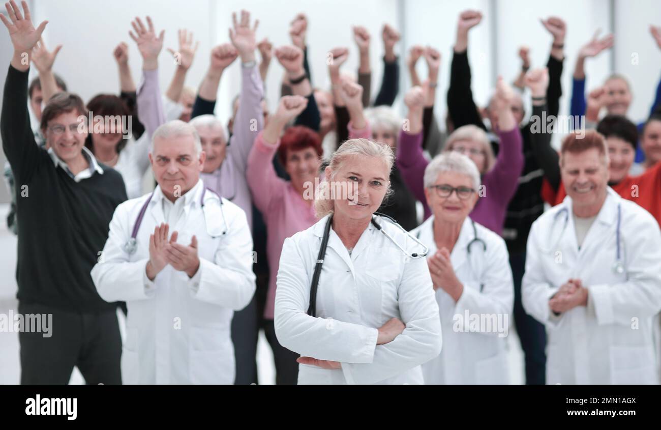 Group doctors and patients clapping their hands to celebrate recovery ...