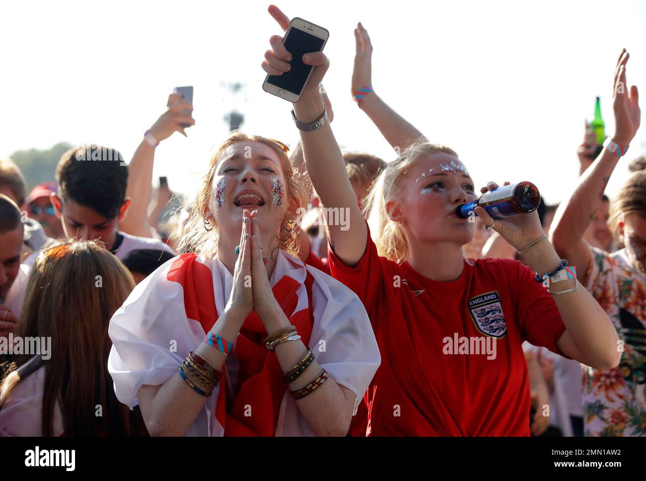 England soccer fans cheer as they wait to watch a live broadcast on a ...