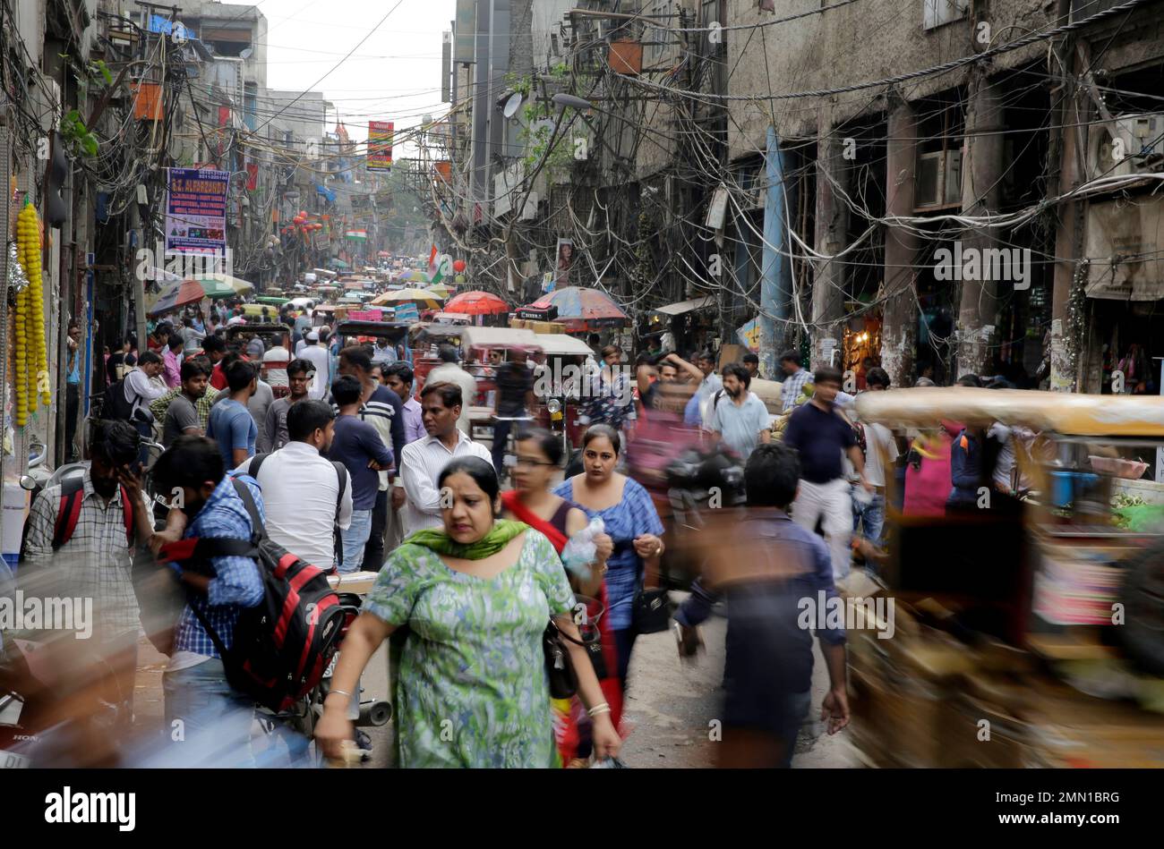 Indians crowd a market place in New Delhi, India, Wednesday, July 11 ...