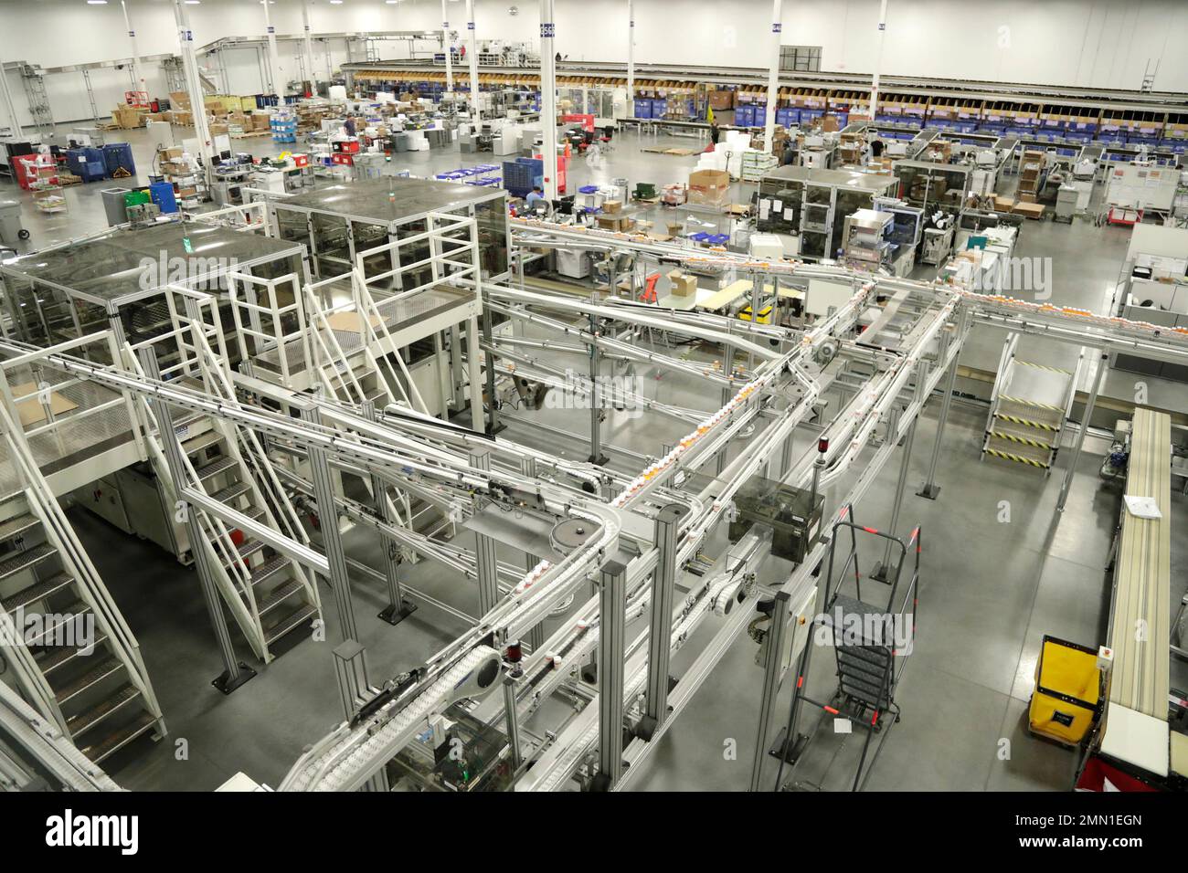 Bottles of medicine ride on a belt at the Express Scripts mail-in ...