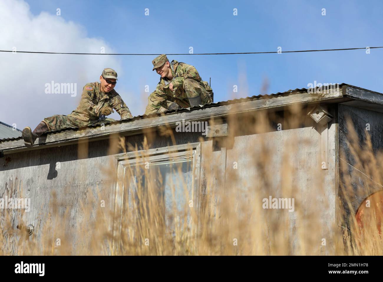 Alaska Army National Guard Spc. Wilson Berlin, left, an infantryman ...