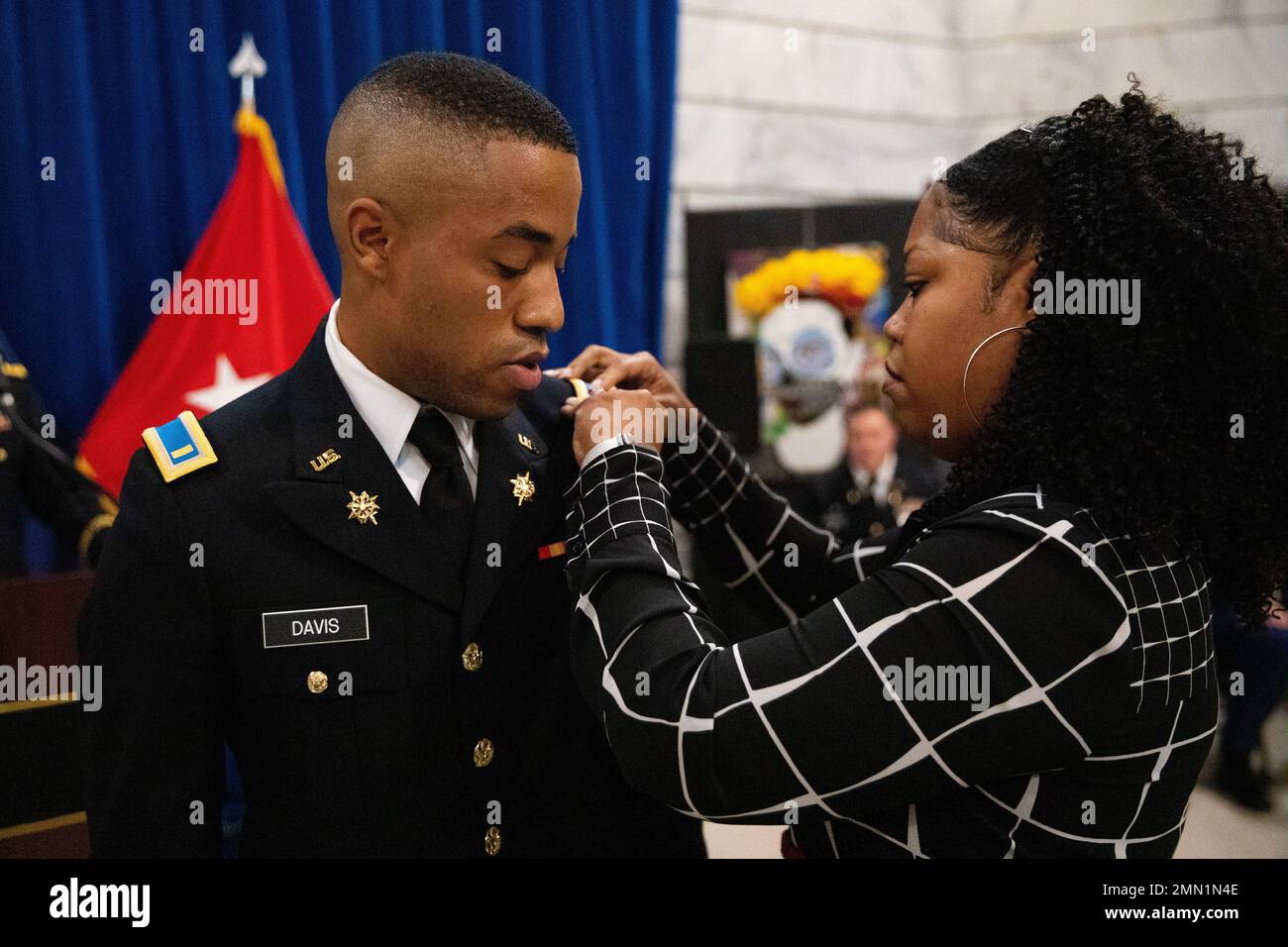 Army officer candidate Isiah Davis is pinned second lieutenant by his ...