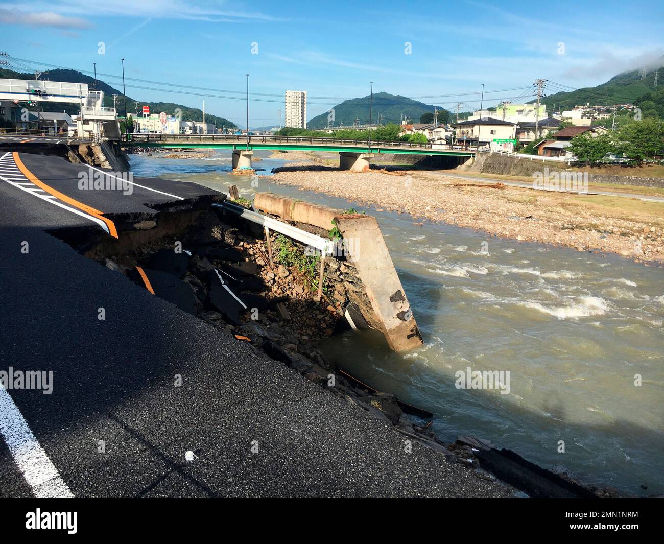 This photo shows a road damage by Seno river in Hiroshima, western ...