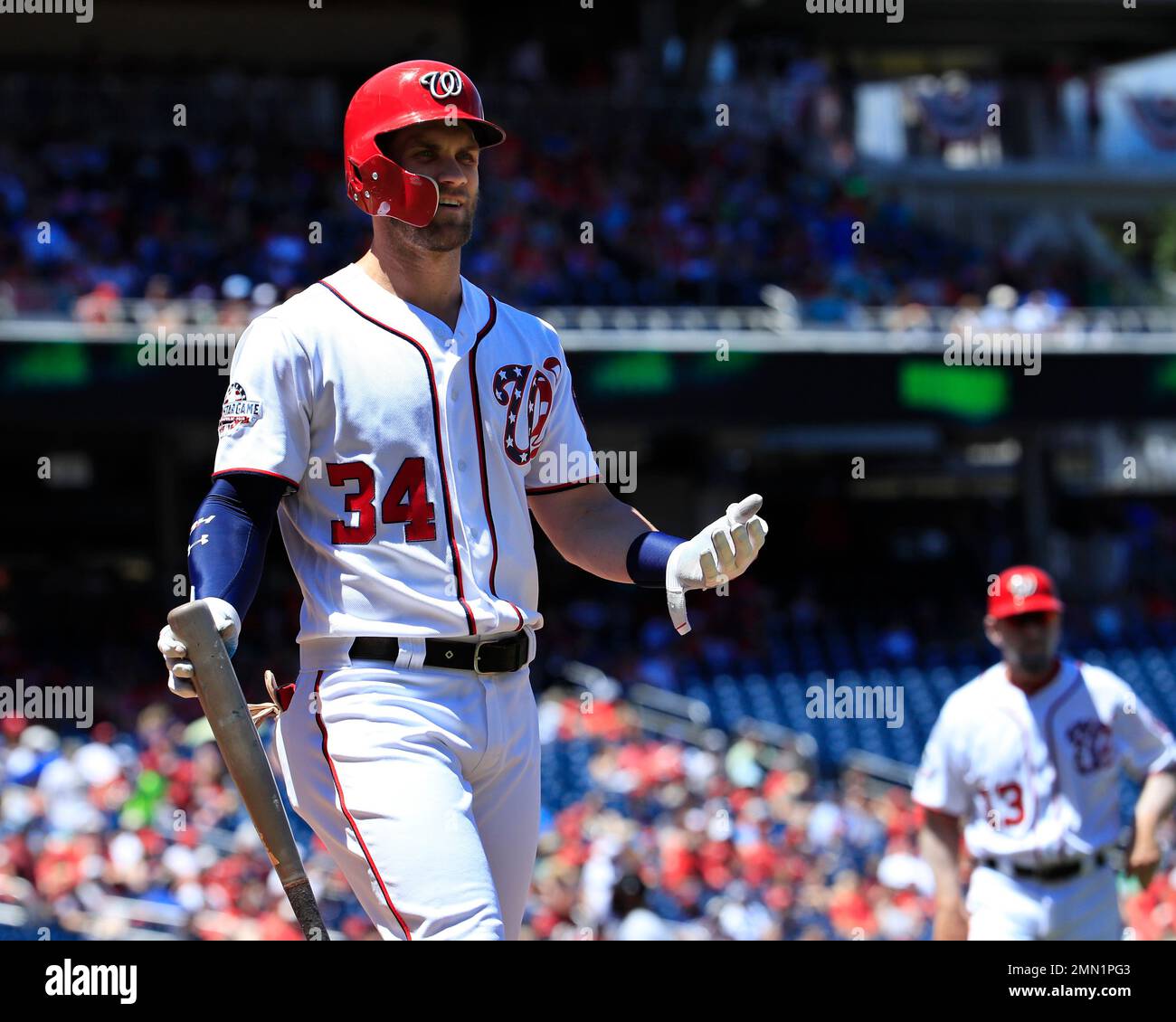 Washington Nationals Bryce Harper (34) gestures after being called out ...