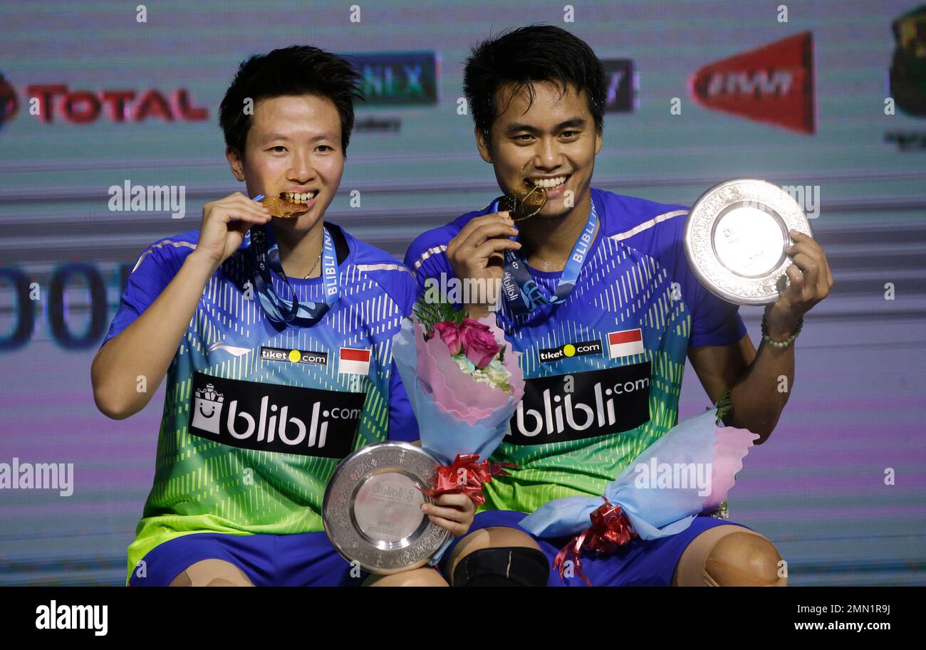 Indonesia's Liliyana Natsir, left, and Tontowi Ahmad pose with their gold medals after defeating ...