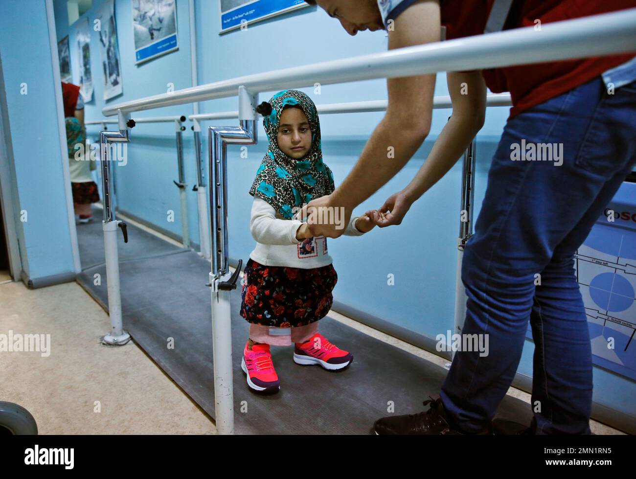 In this Thursday, July 5, 2018 photo, Maya Meri is guided by a ...