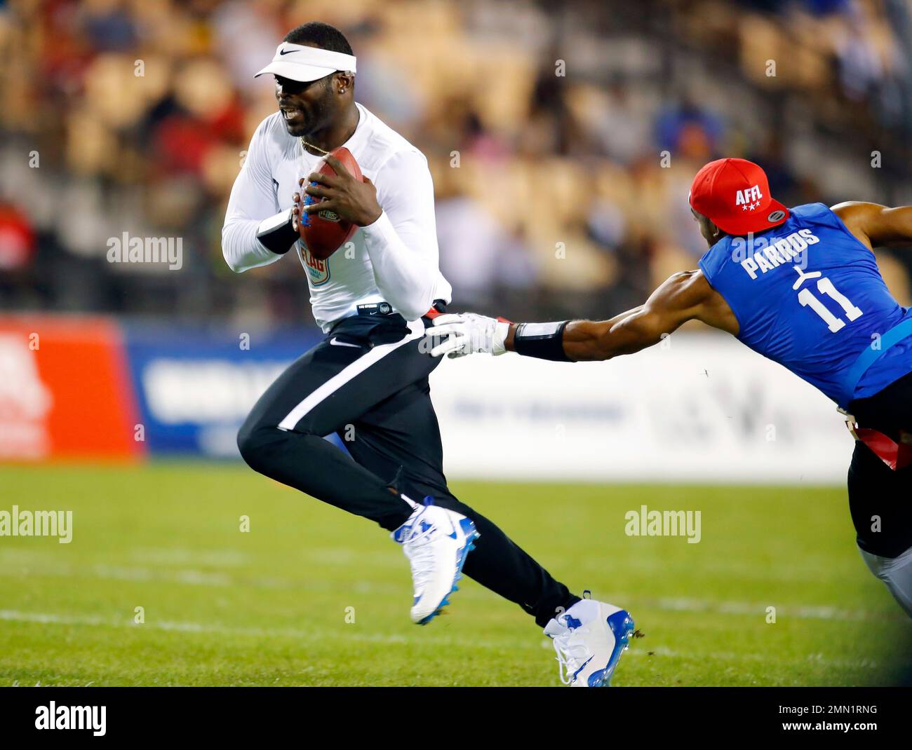 Ocho's Clayton Parros, right, reaches for the flag of Roadrunners ...