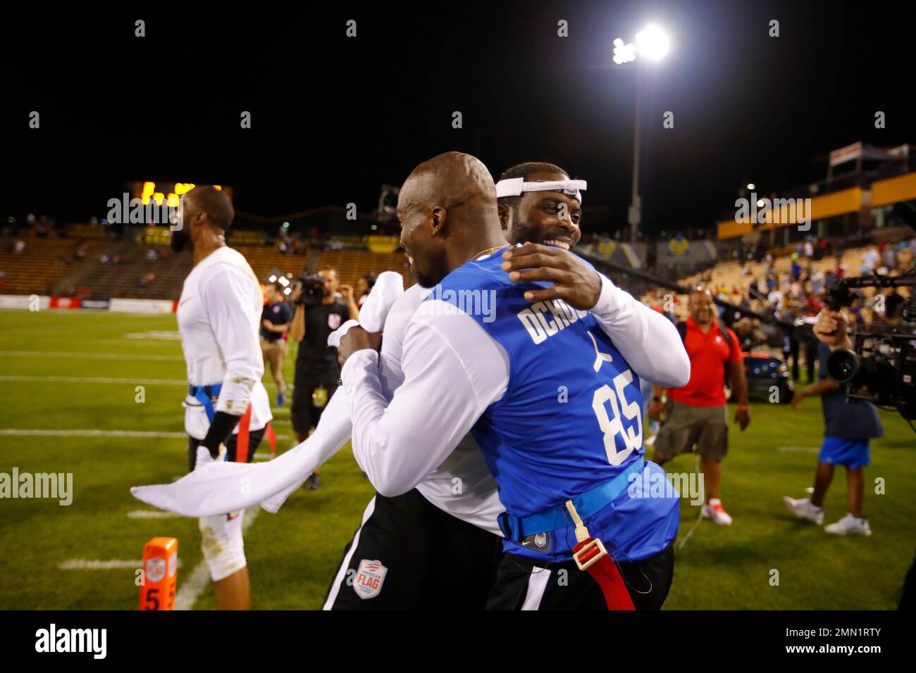 Ocho's Chad Ochocinco embraces Roadrunners' Michael Vick after Ocho won ...