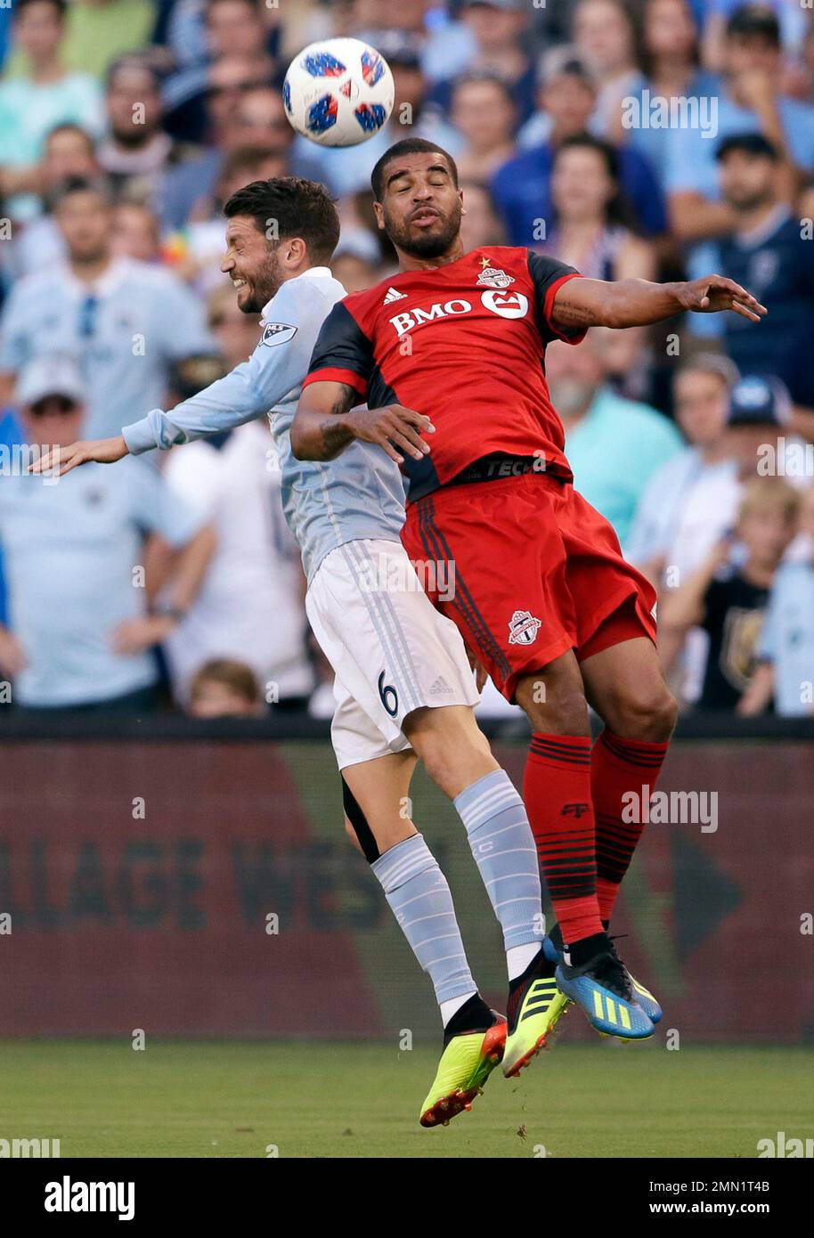 Sporting Kansas City midfielder Ilie Sanchez (6) heads the ball next to ...