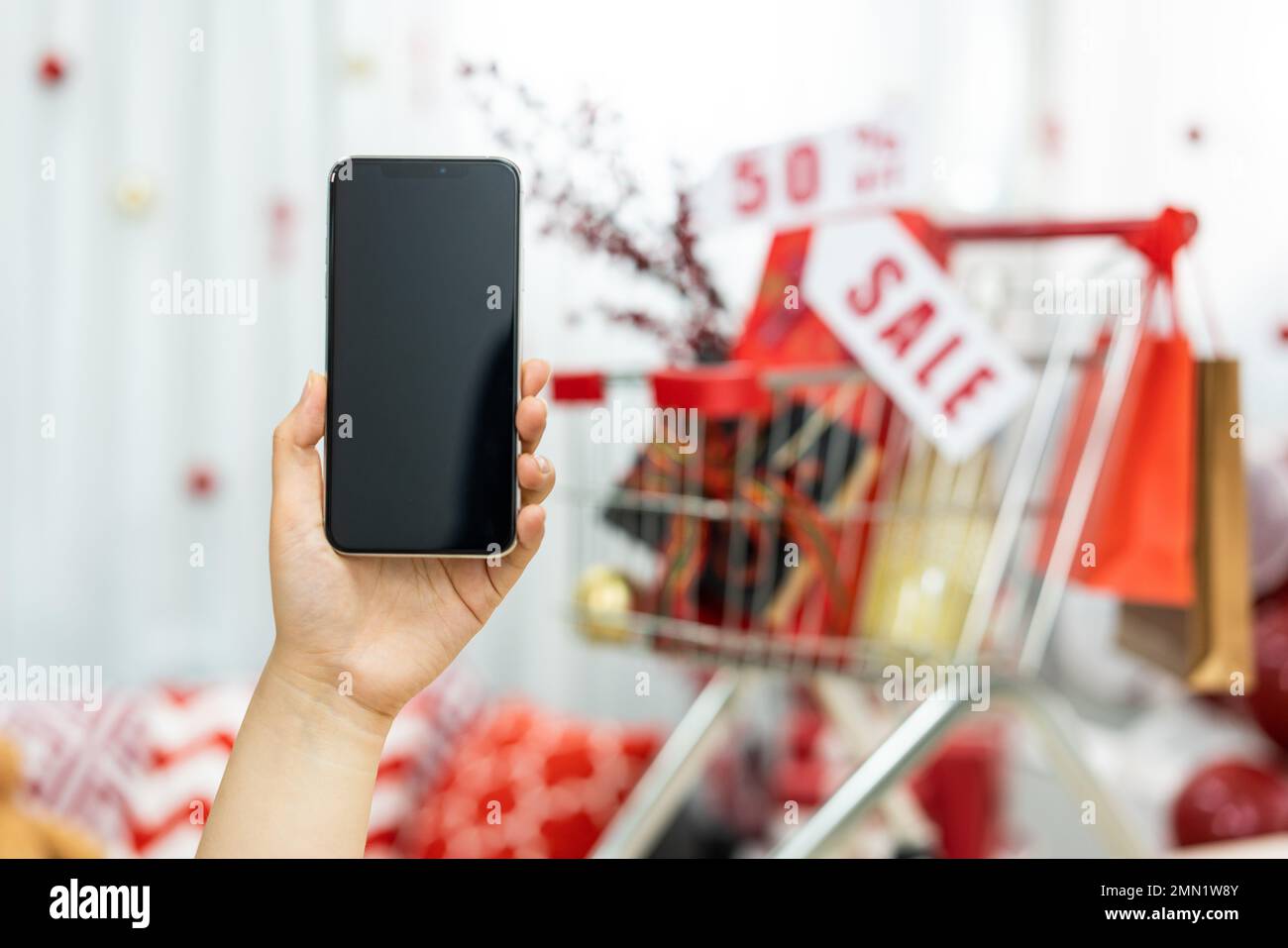 Mobile phones and a shopping cart Stock Photo - Alamy