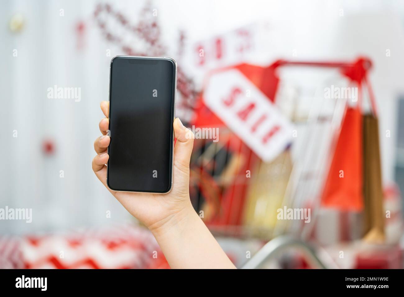 Mobile phones and a shopping cart Stock Photo - Alamy