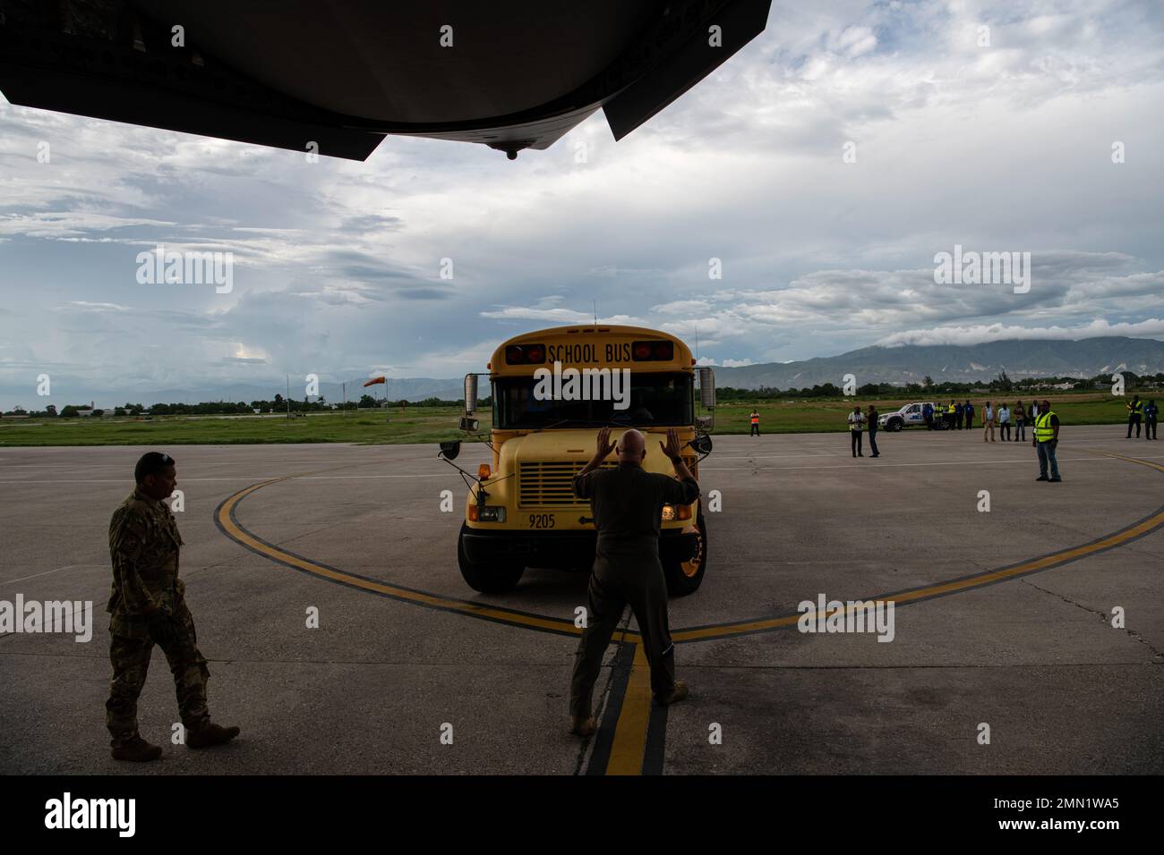 Tech. Sgt. Christopher Raymond, 301st Airlift Squadron, guides a school ...