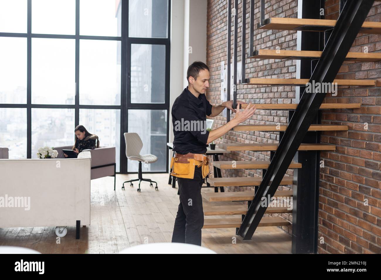 Home improvement handyman building staircase in a natural light Stock Photo - Alamy