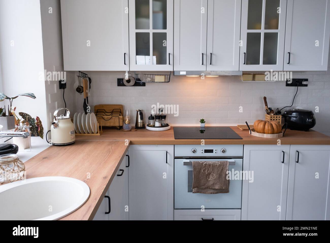 White cozy kitchen in Scandi loft style. Home interior, dining room ...