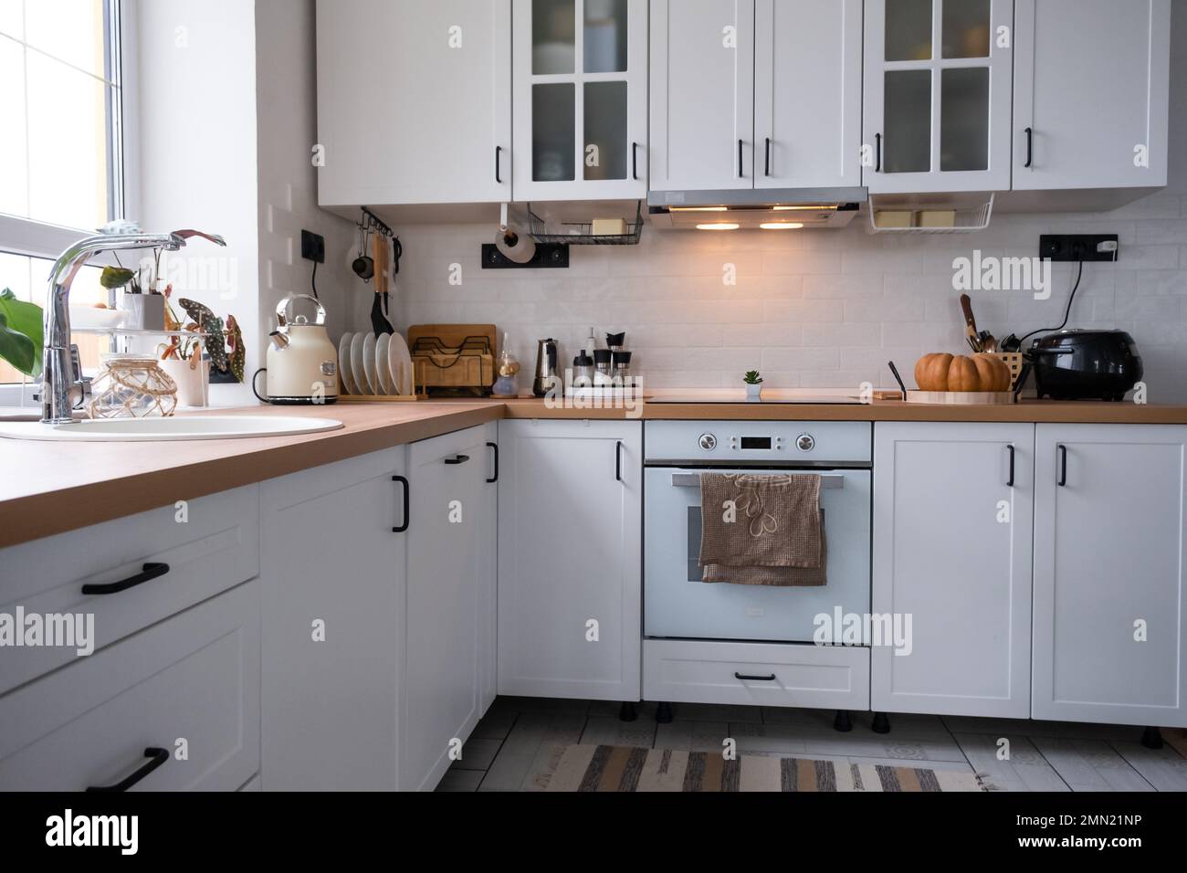 White cozy kitchen in Scandi loft style. Home interior, dining room ...