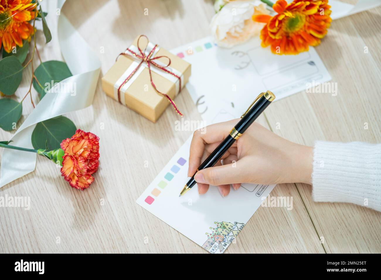 The young woman to write CARDS Stock Photo - Alamy
