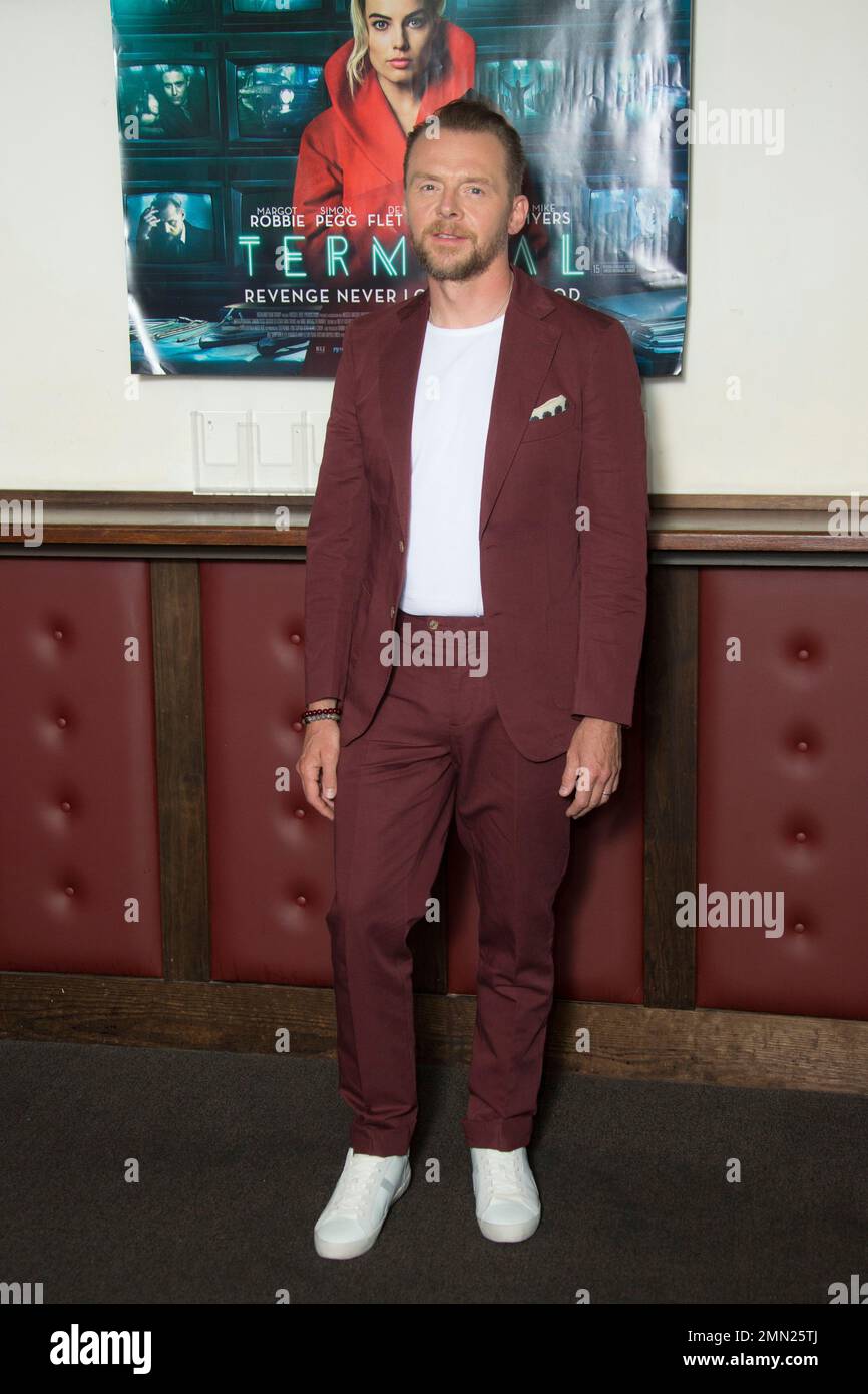 Actor Simon Pegg poses for photographers upon arrival at the UK ...