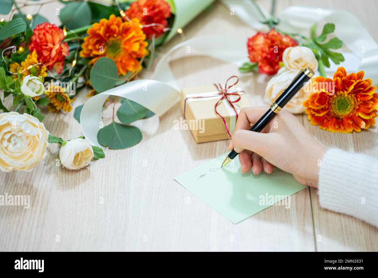 The young woman to write CARDS Stock Photo - Alamy