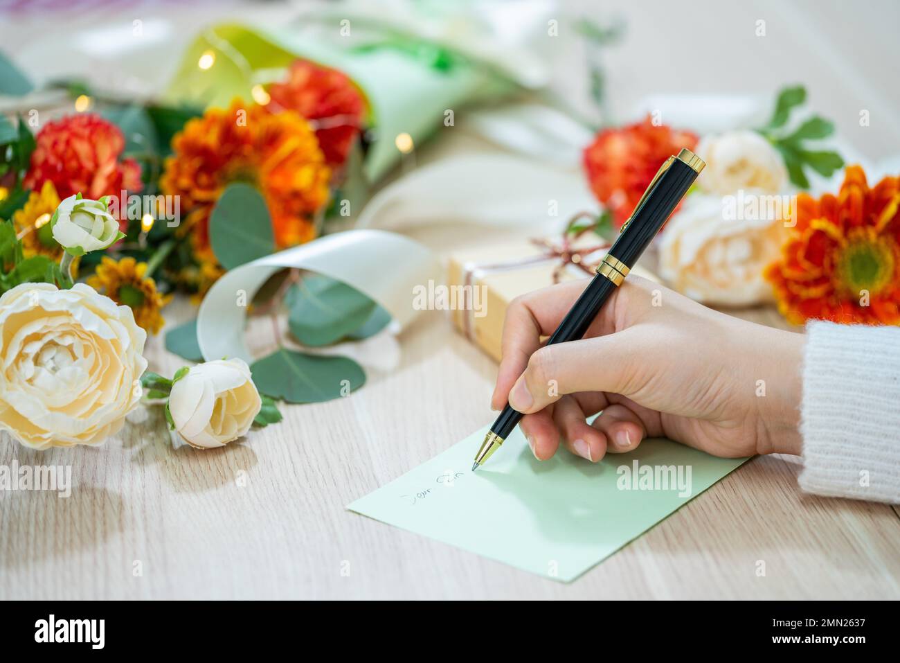 The young woman to write CARDS Stock Photo - Alamy