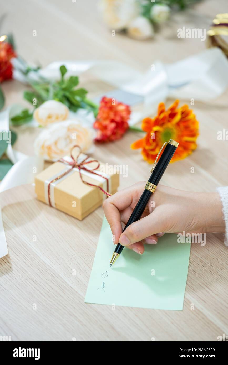 Young woman write cards hi-res stock photography and images - Alamy