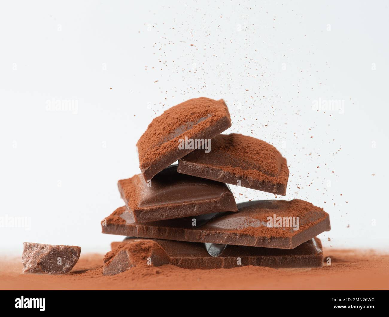 chocolate with falling cocoa powder Stock Photo - Alamy