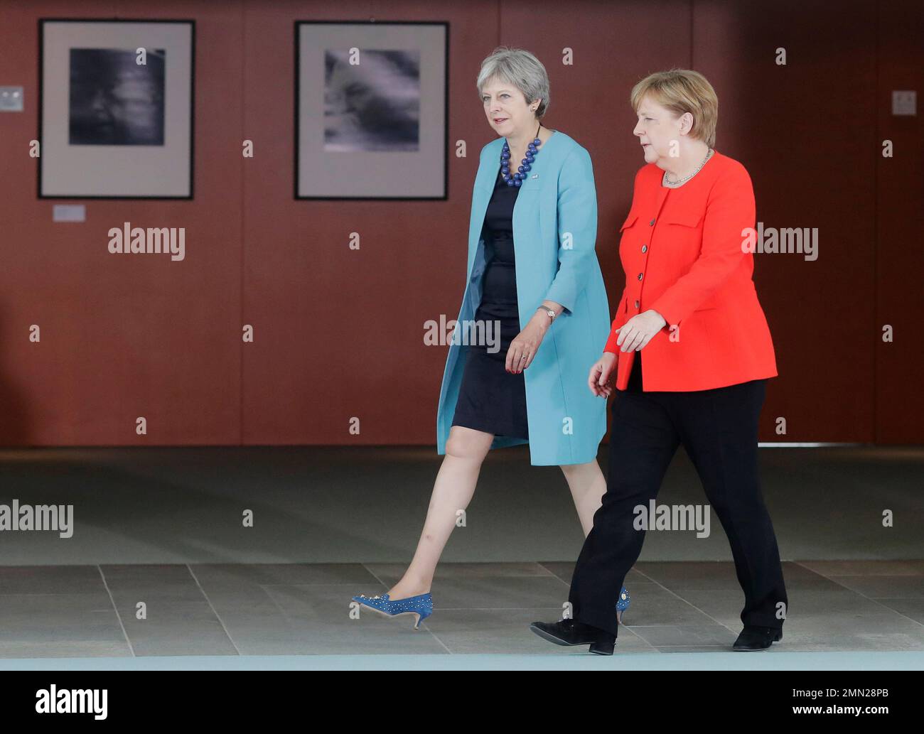 German Chancellor Angela Merkel, right, and British Prime Minister ...