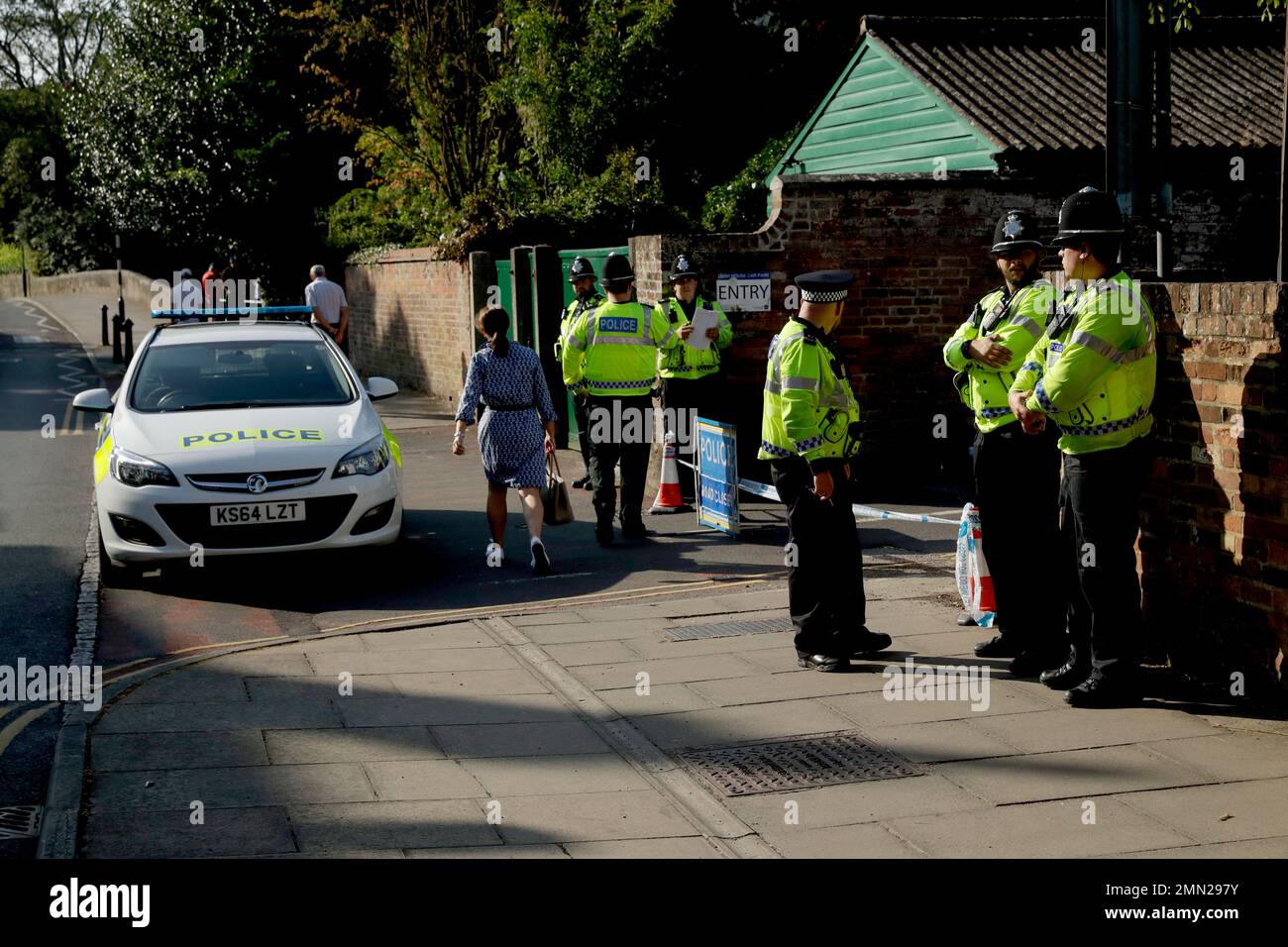 British police officers guard a cordon which was extended overnight to ...