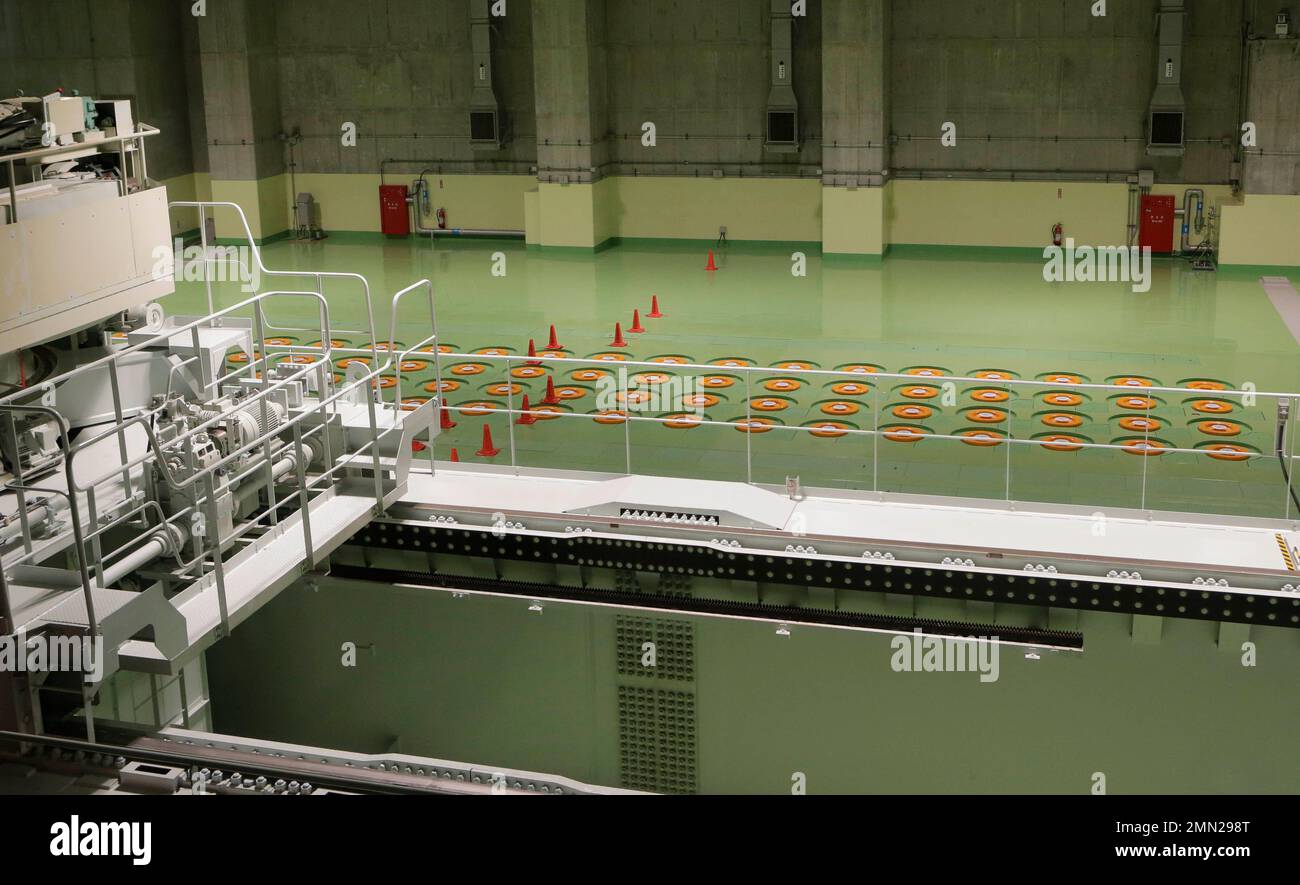 FILE - This Nov. 8, 2012, file photo shows a floor crane, foreground ...