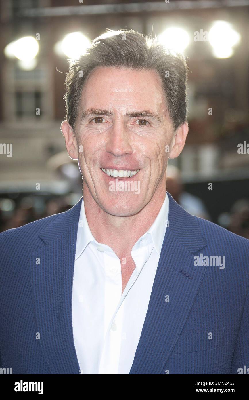 Actor Rob Brydon poses for photographers upon arrival at the UK ...