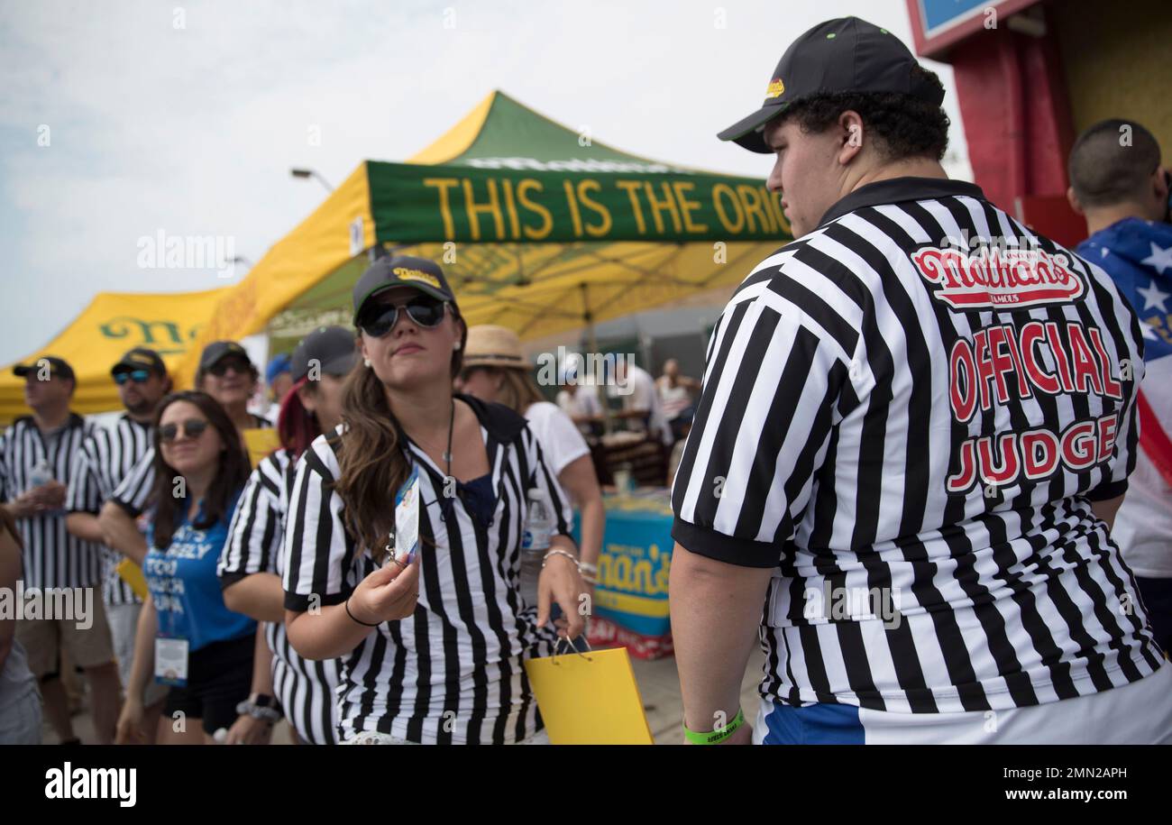 The judges line up ahead of the women's competition of the Nathan's ...