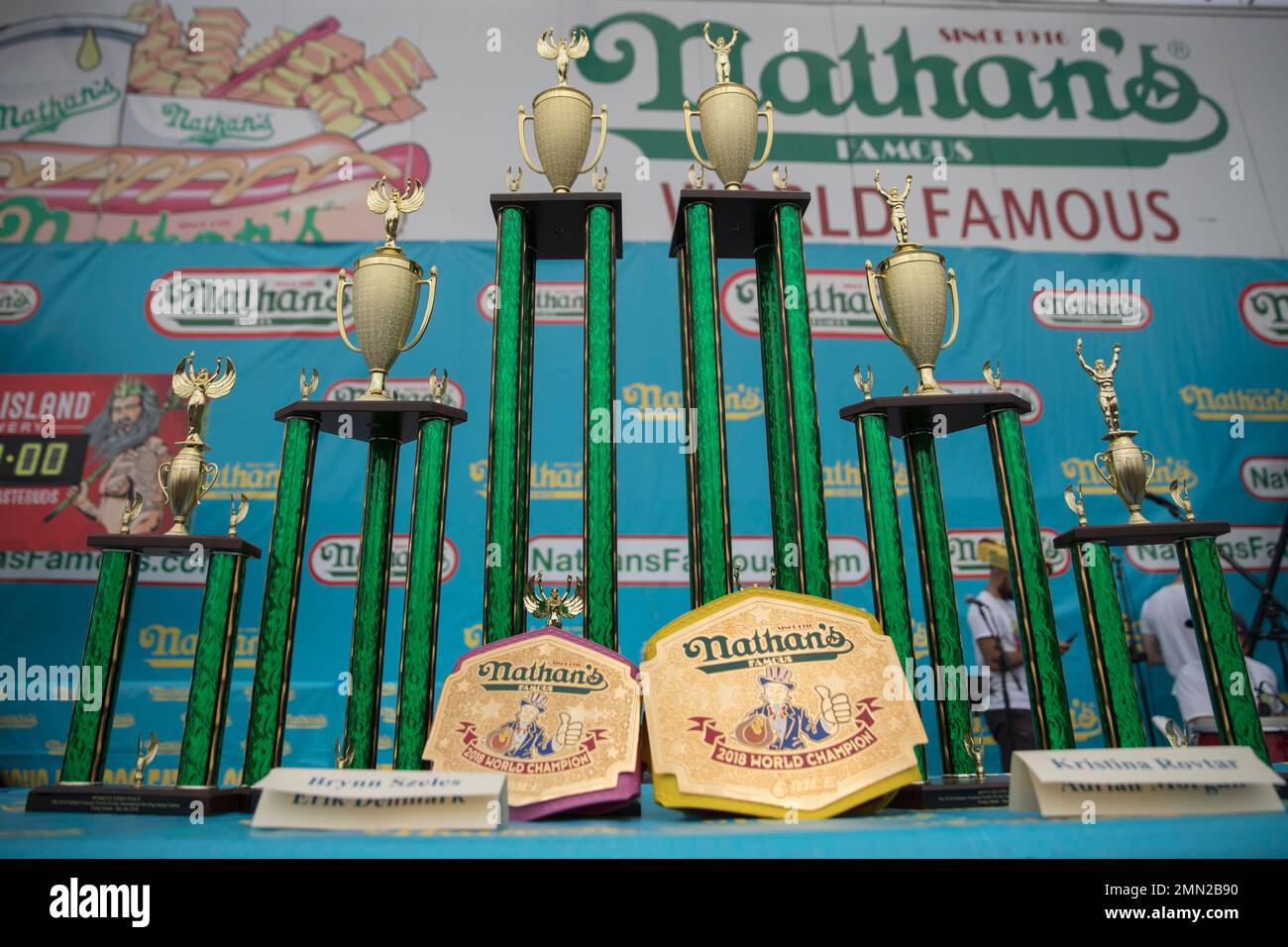 The trophies and champion belts are on display on stage ahead of the ...