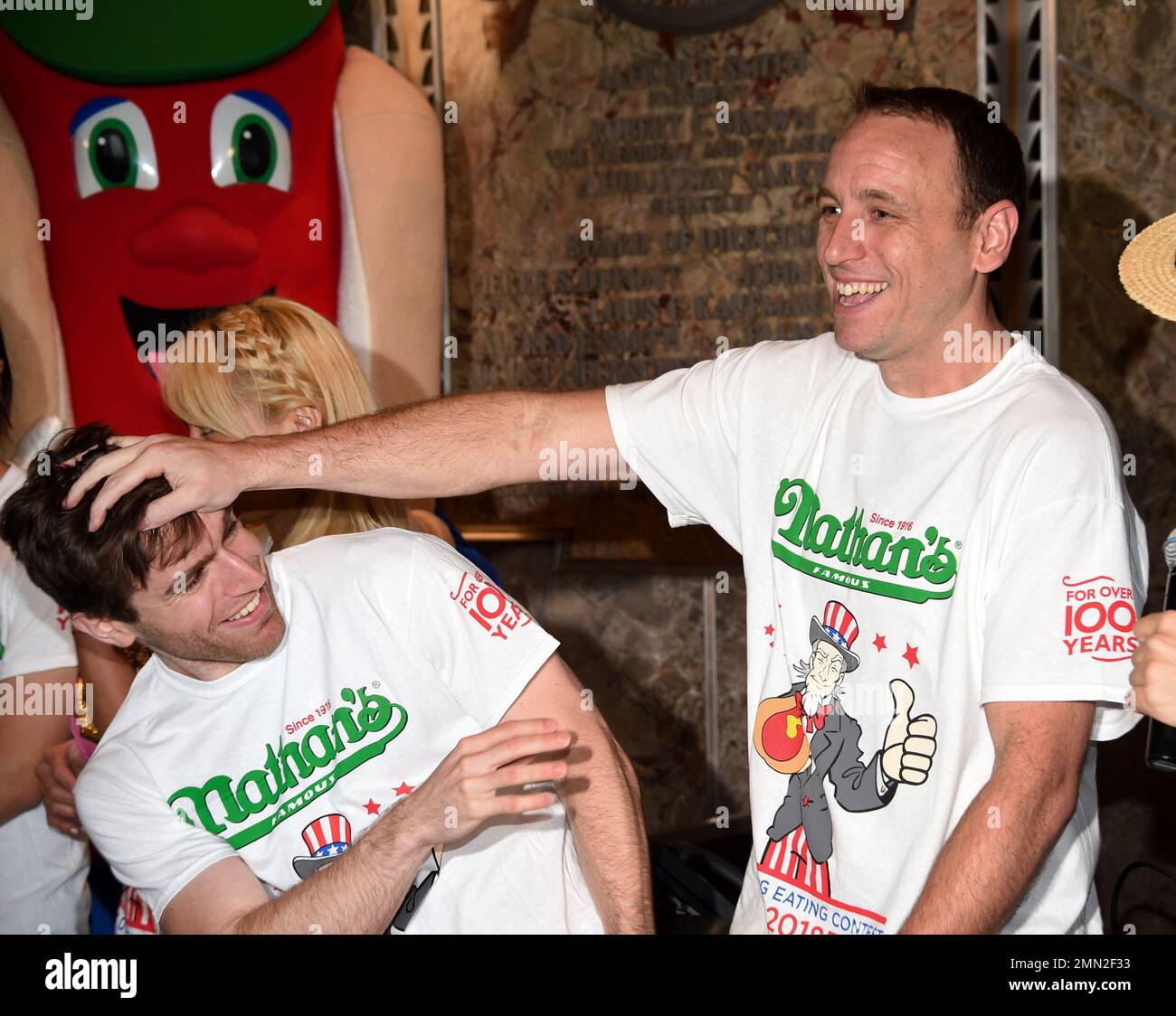 Carmen Cincotti, left, and defending champion Joey Chestnut joke around ...