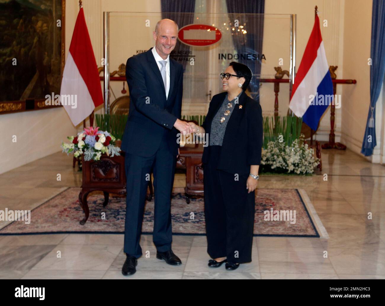 Dutch Foreign Minister Stef Blok, left, poses with his Indonesian ...