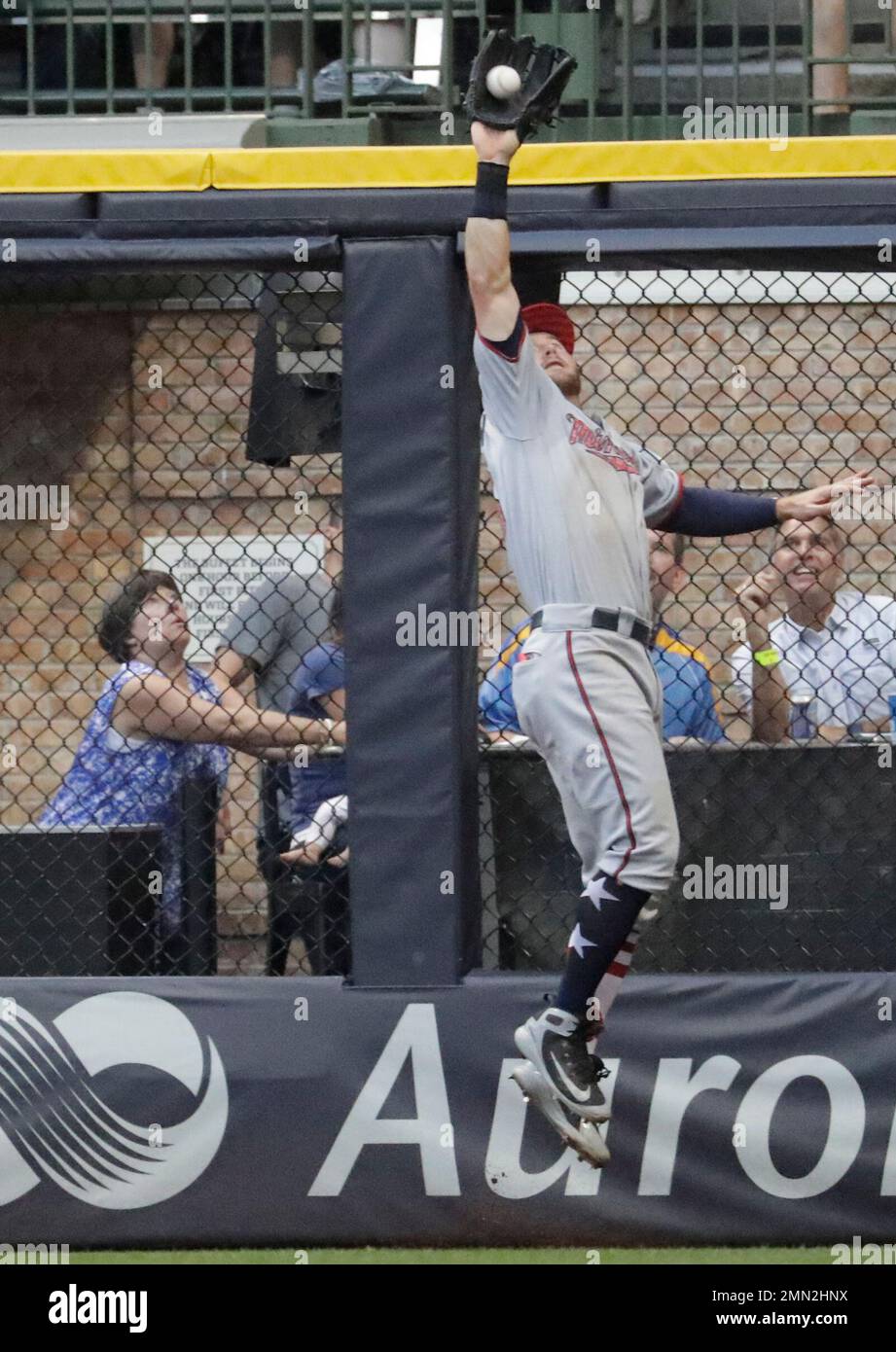 Minnesota Twins' Robbie Grossman makes a leaping catch of a ball hit by ...