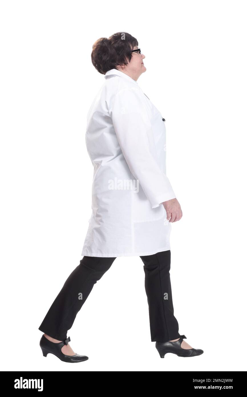 older female doctor with a stethoscope walks forward Stock Photo - Alamy