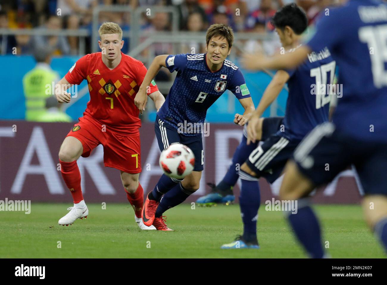 Japan's Genki Haraguchi, centre, looks at teammate Shinji Kagawa during ...