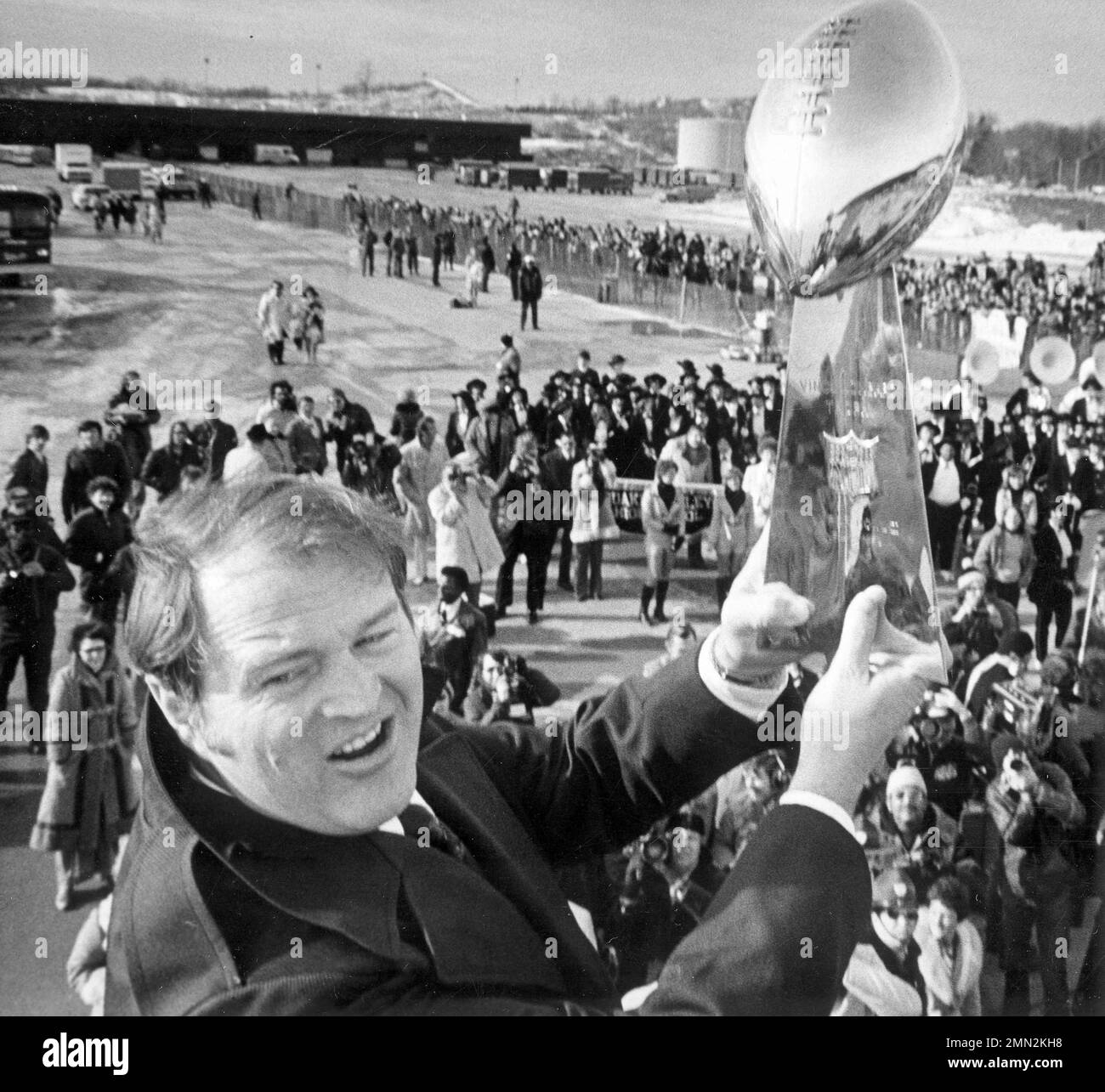 Pittsburgh Steelers coach Chuck Noll holds up the Super Bowl trophy to ...