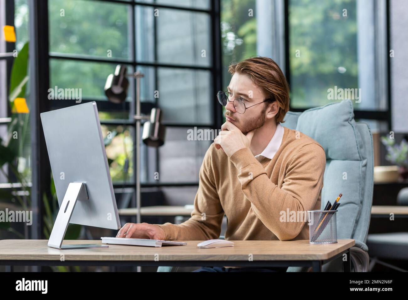 Focused young man thinking idea hi-res stock photography and images - Alamy
