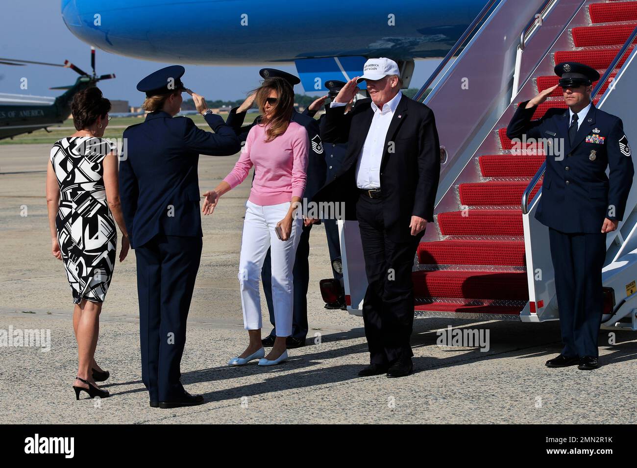 President Donald Trump and first lady Melania Trump are greeted on the ...