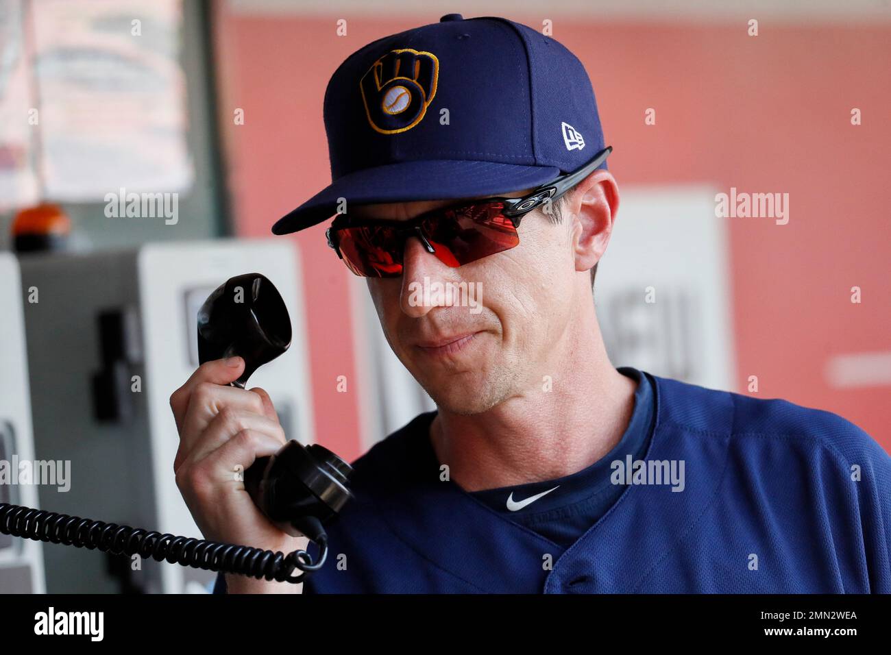 Milwaukee Brewers manager Craig Counsell works in the dugout in the ...