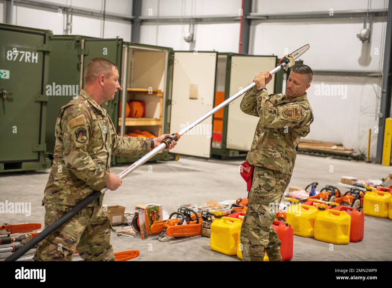U.S. Air Force Tech Sgt. Chris Linton (left) and Tech Sgt. James Bishop ...