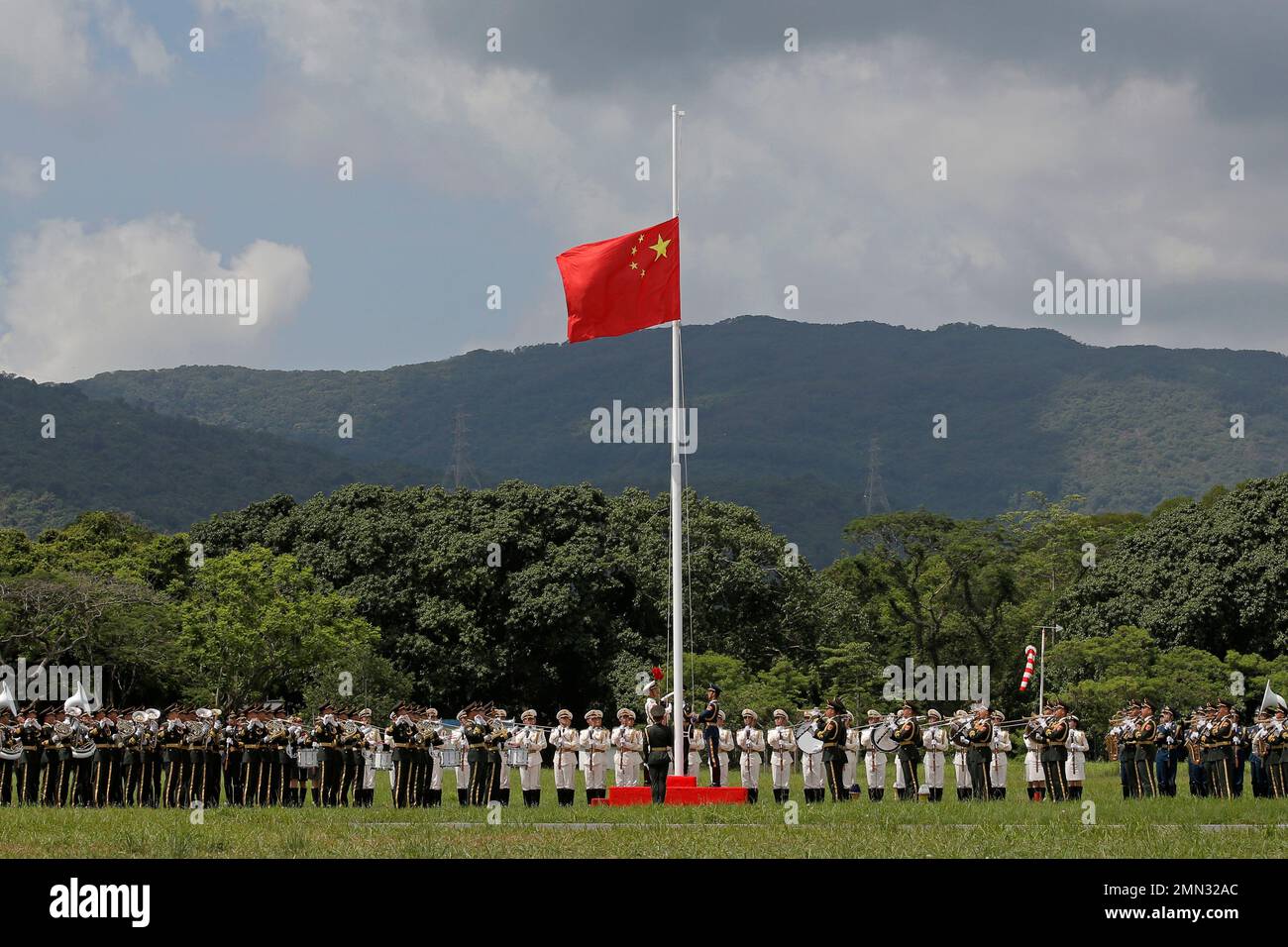 Soldiers attend a flag raising ceremony at the Shek Kong barracks of ...