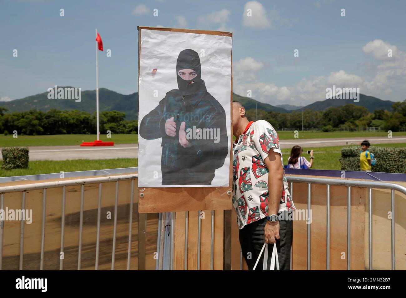 A visitor looks at a shooting target at the Shek Kong barracks of ...