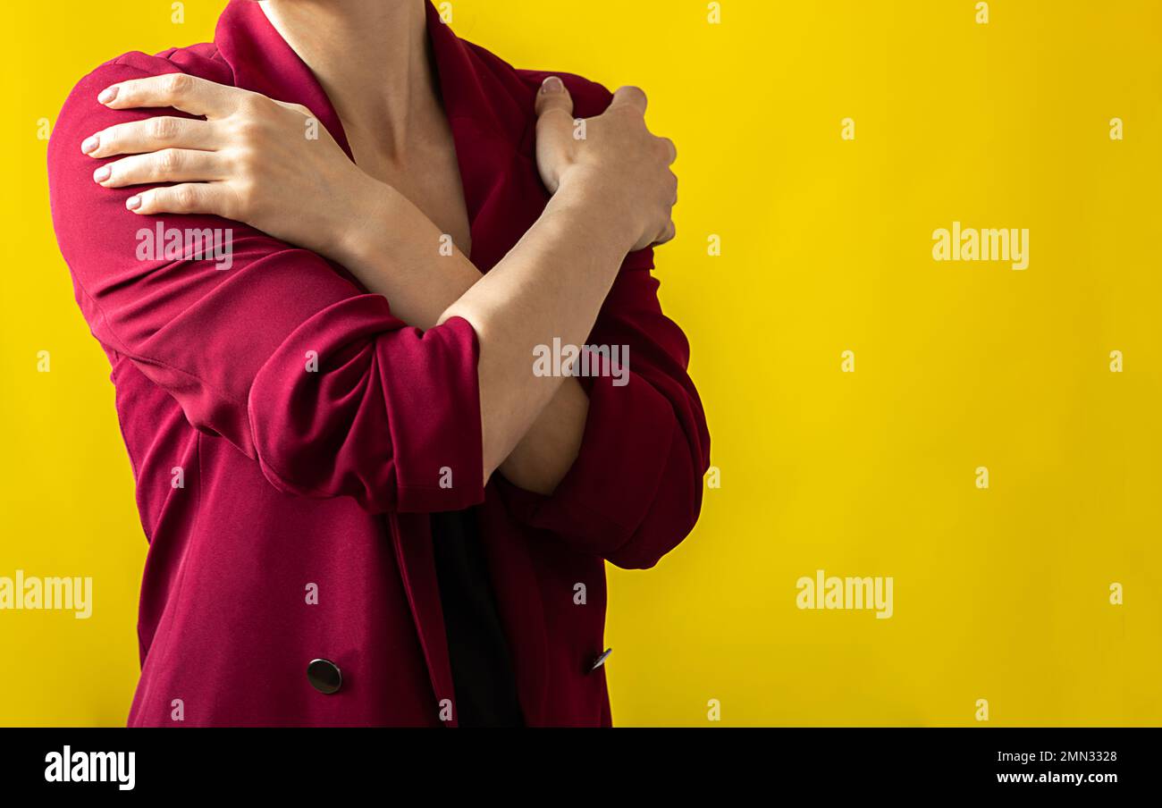 Embrace equity. Woman hug yourself dressed magenta jacket on yellow ...