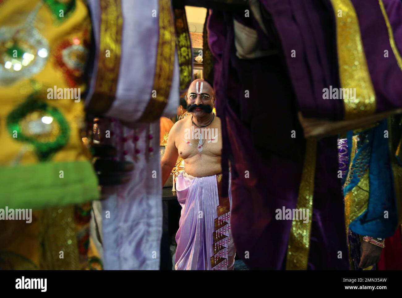 An Indian actor dressed as Guha, a character of Hindu epic Ramayana ...