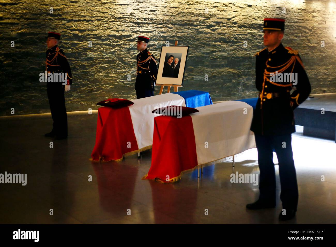The flag-draped coffins of French politician Simone Veil, right, and ...